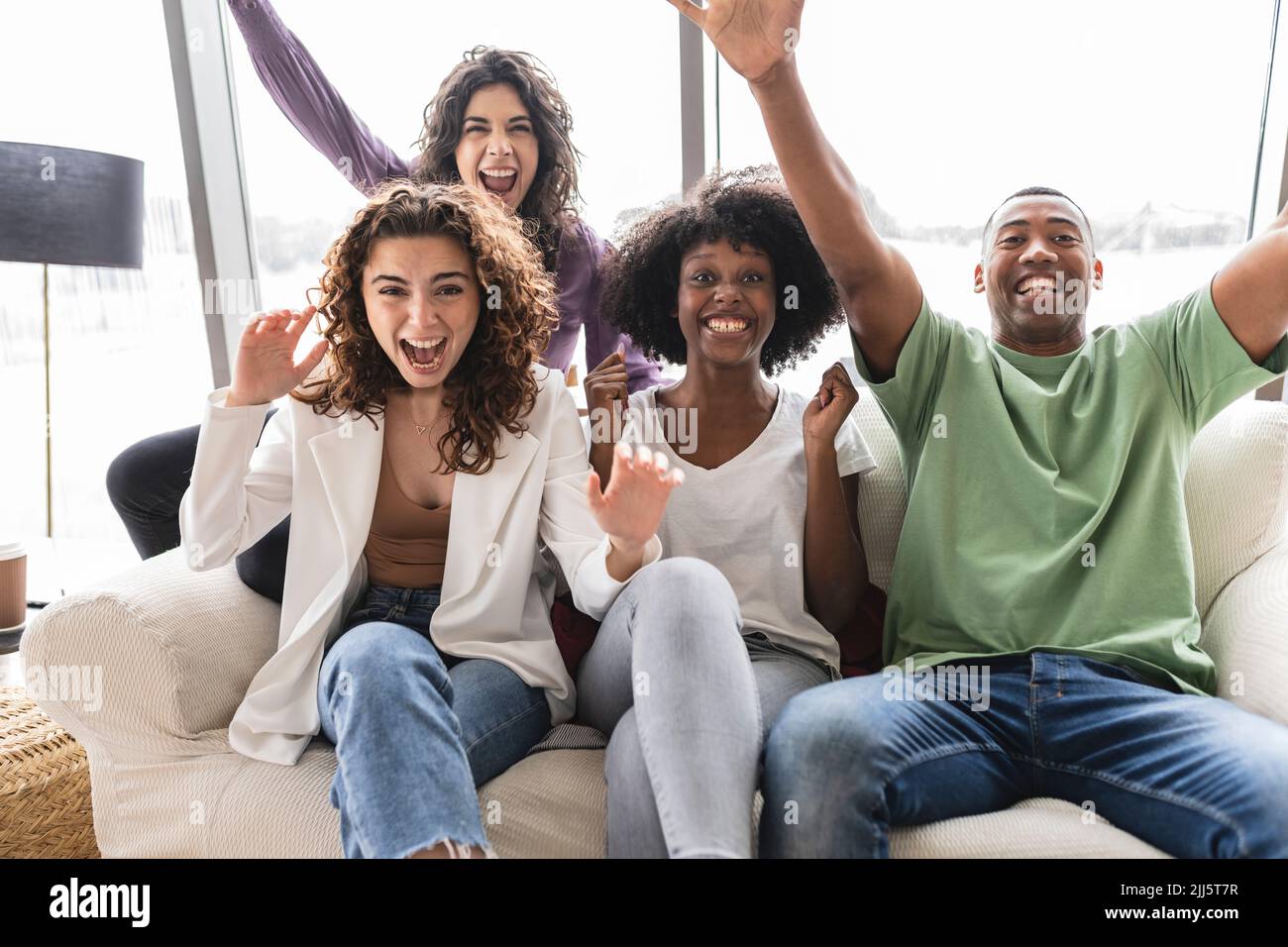 Diverse friends on sofa hi-res stock photography and images - Alamy