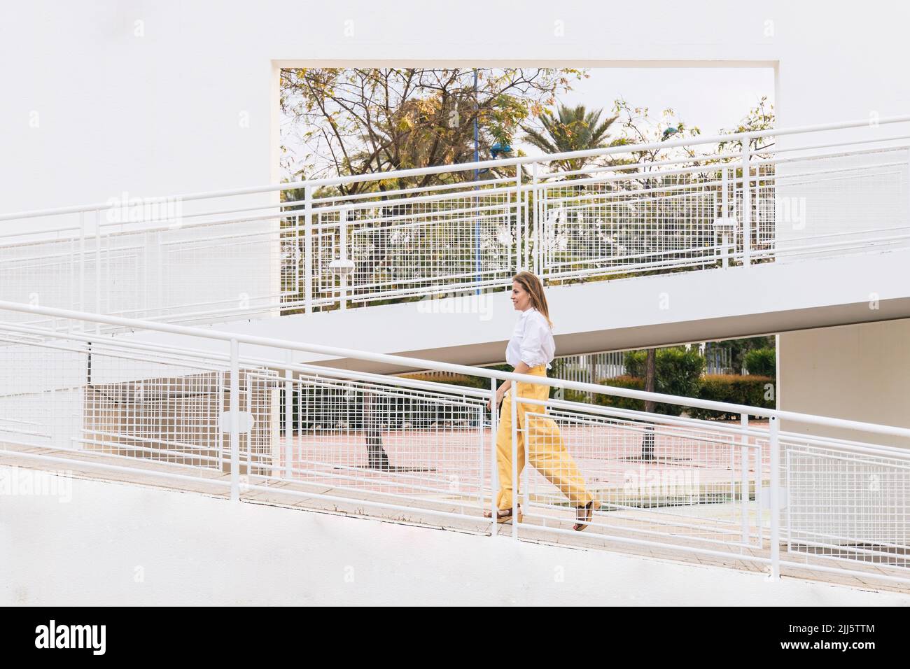 Professional women walking side view hi-res stock photography and ...