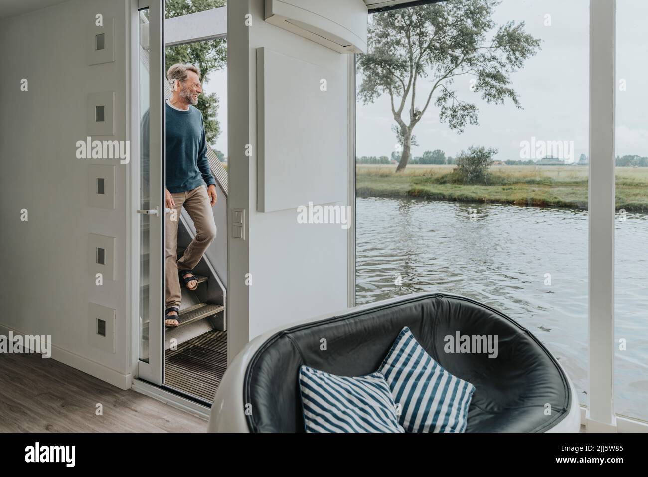 Man walking downstairs hi-res stock photography and images - Alamy