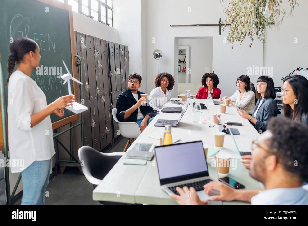 Colleagues laptops wind turbine hi-res stock photography and images - Alamy