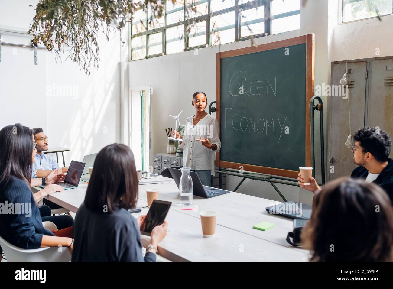 Colleagues laptops wind turbine hi-res stock photography and images - Alamy
