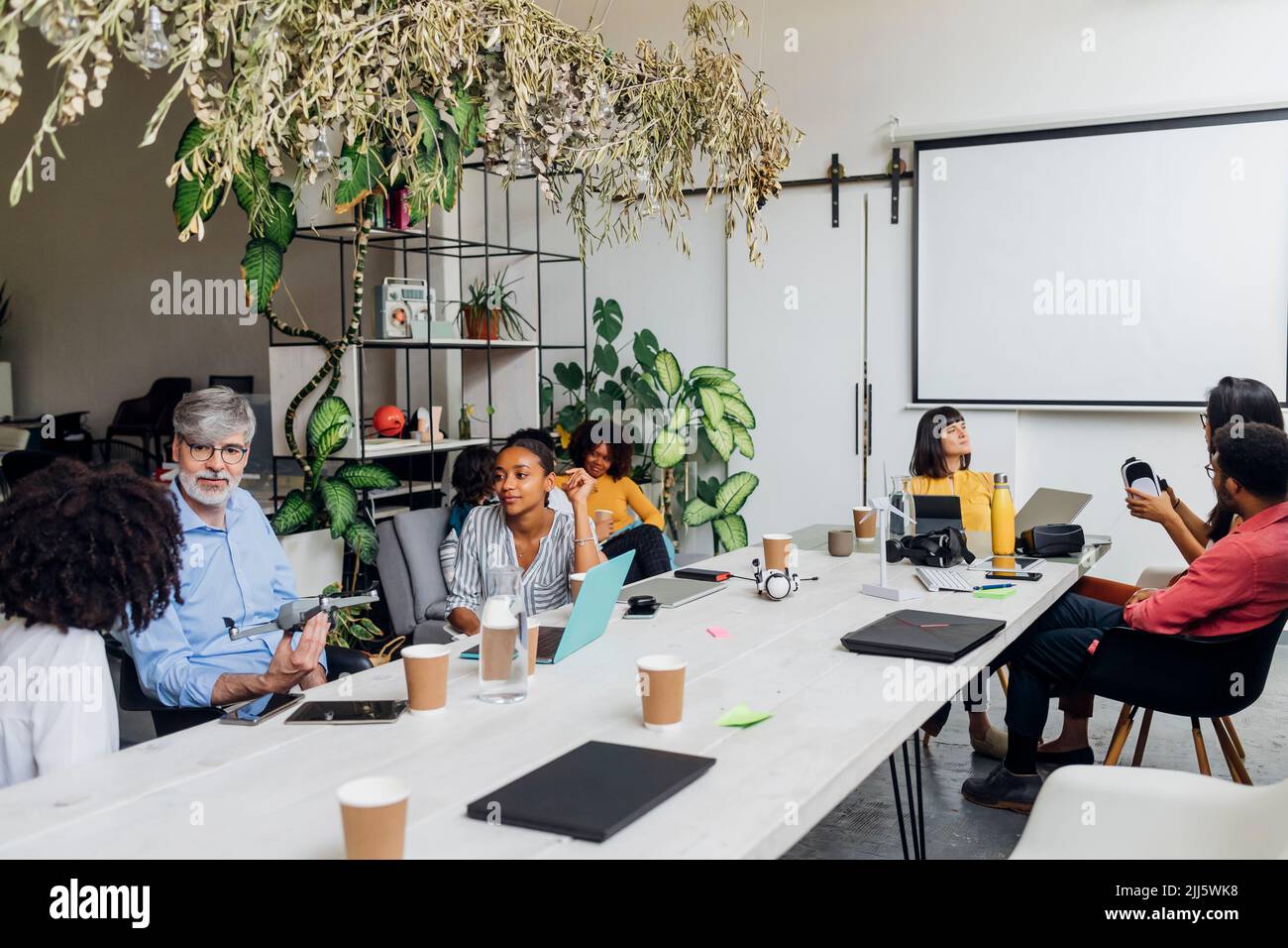 Multiracial colleagues brainstorming at coworking office Stock Photo - Alamy