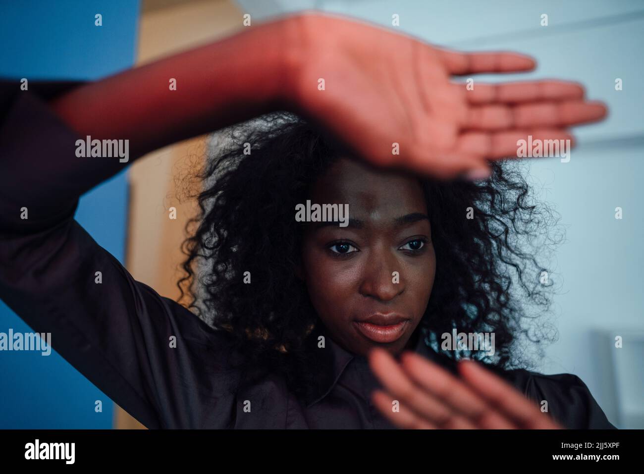 Young woman gesturing with hands Stock Photo - Alamy