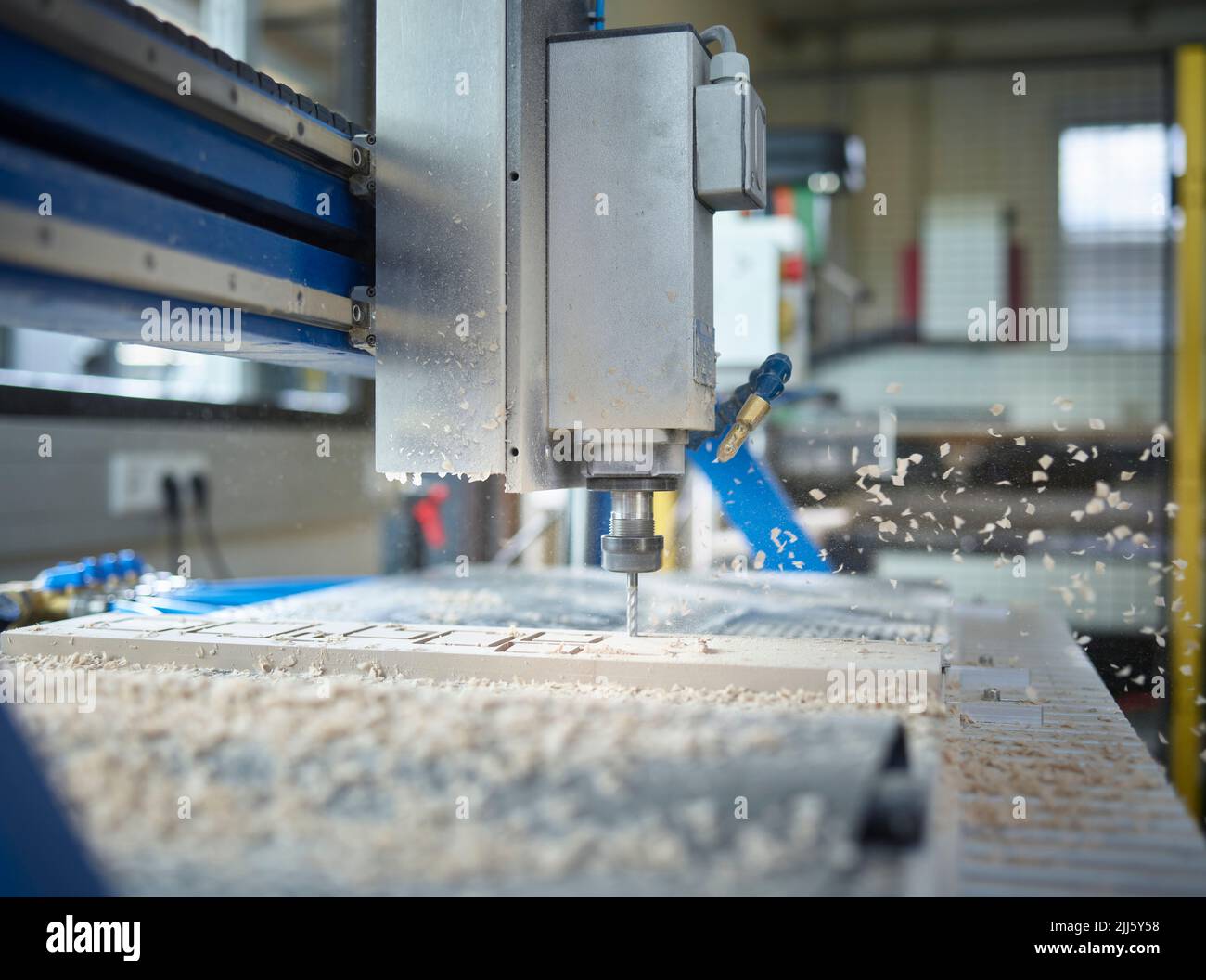 CNC machine cutting wood in factory Stock Photo - Alamy