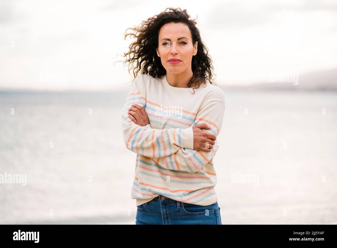 Woman stand in front of sea hi-res stock photography and images - Alamy
