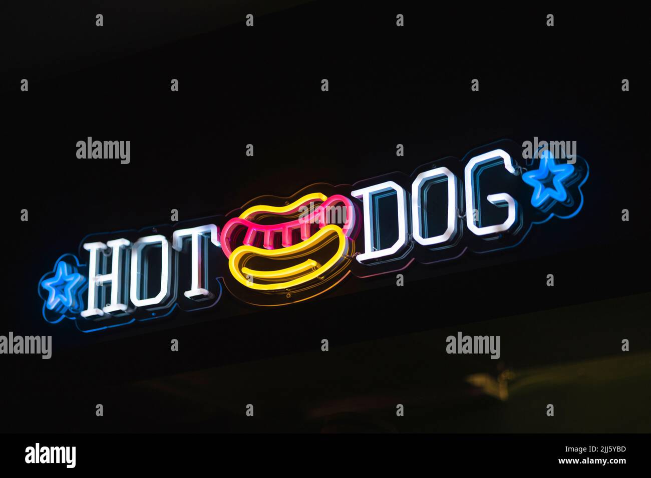 Neon sign advertising fast food restaurant Stock Photo - Alamy