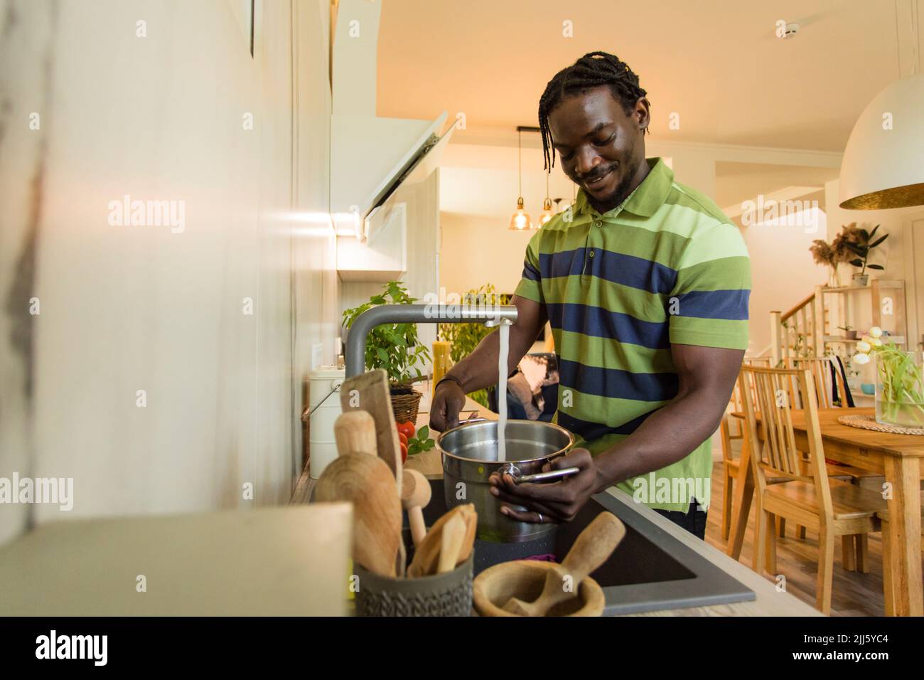Filling water pot hi-res stock photography and images - Alamy