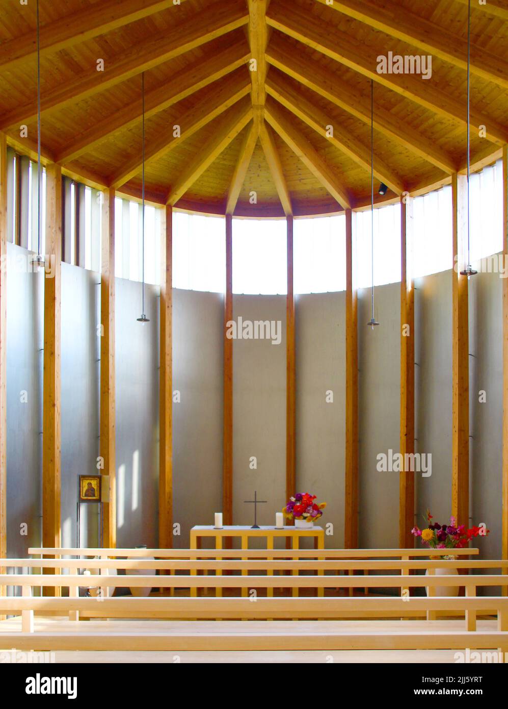 Interior of the altar of a small chapel built of wood. Religious ...