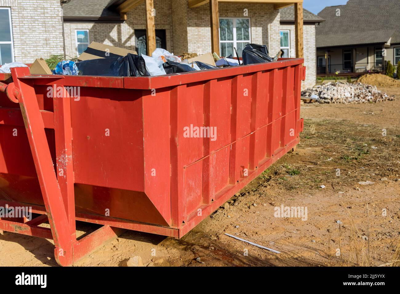 In order to recycle garbage, a metal container trash dumpster is used ...