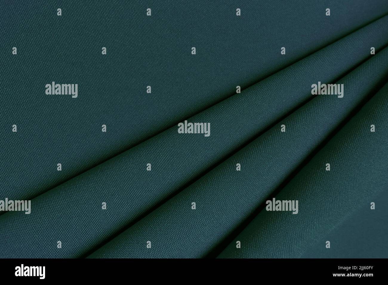 Green crumpled or wavy fabric texture background. Abstract linen cloth ...