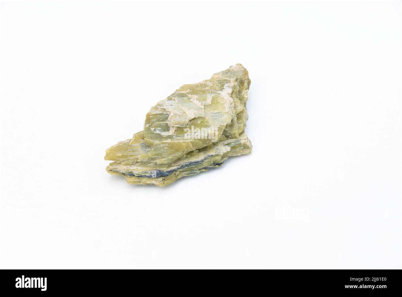 layer of a thin mineral on a rock isolated over white background Stock ...
