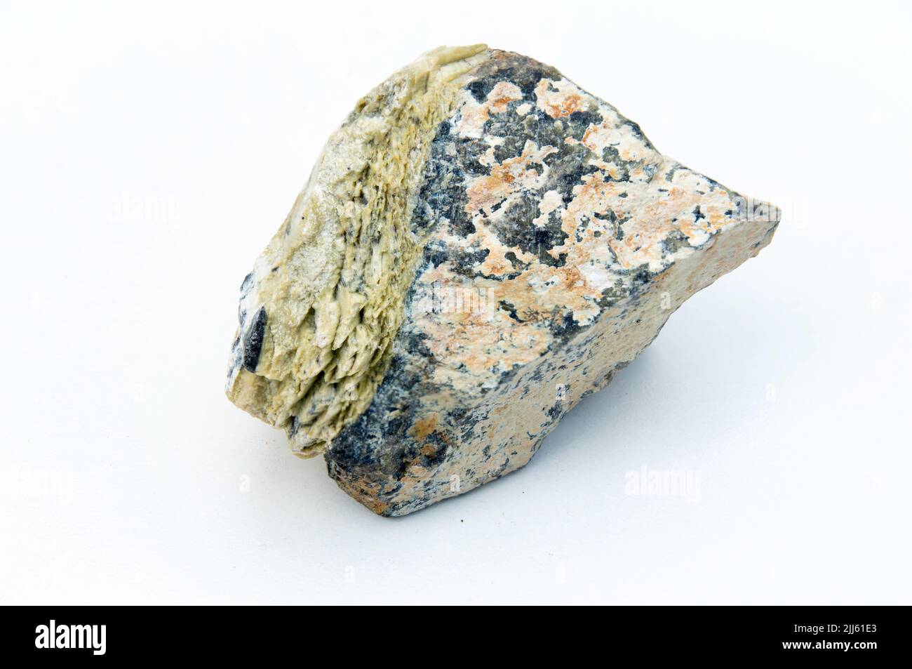 layer of a thin mineral on a rock isolated over white background Stock ...