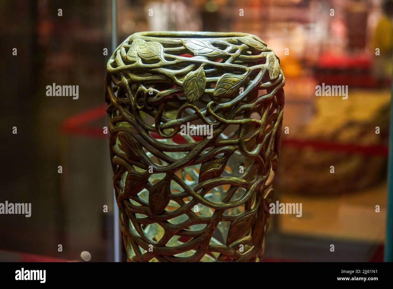 Wooden root carved vase in the museum Stock Photo - Alamy