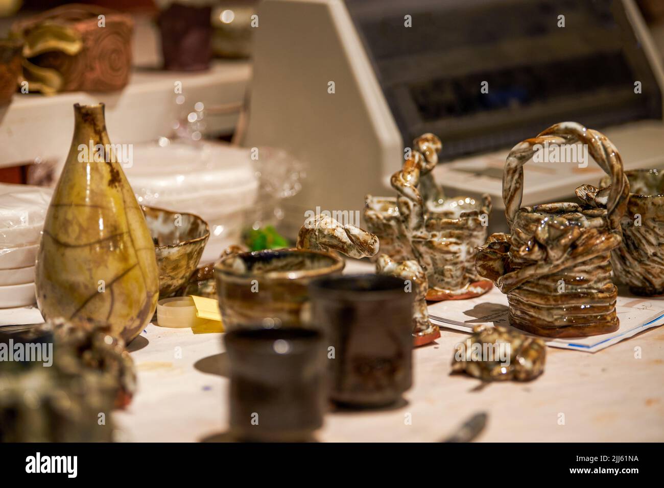 Various clay products in a clay shop Stock Photo - Alamy