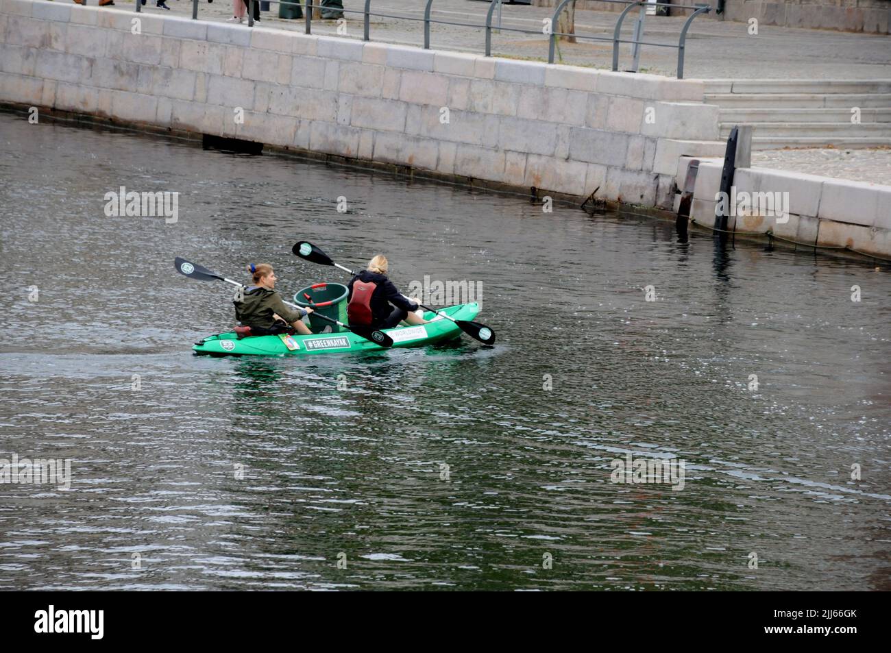 Copenhagen /Denmark/23 July 2022/ Greenkayak sailoor picking up garbage ...