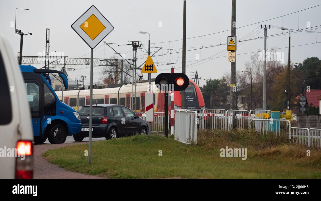 Legionowo, Poland - November 3, 2021: Train and cars at the railroad ...
