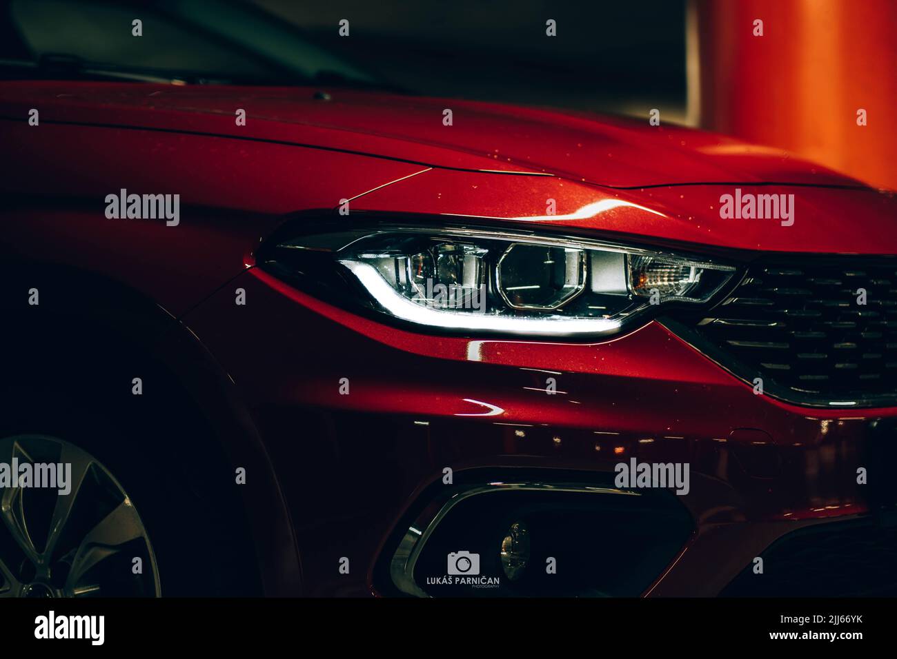 Beautiful red fiat tipo parked in a dark garage with stunning lead ...