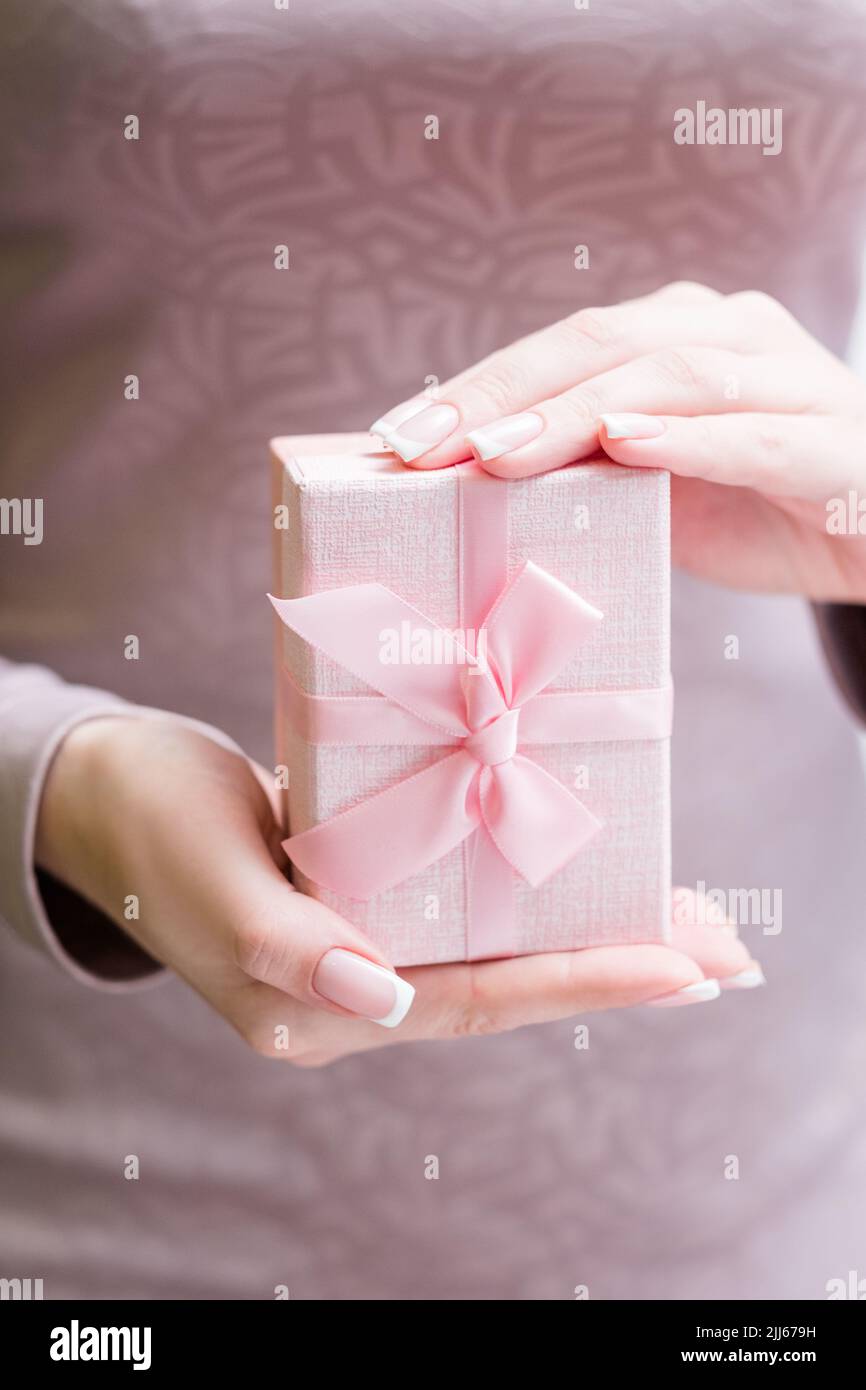 woman hold present package holiday gift Stock Photo - Alamy