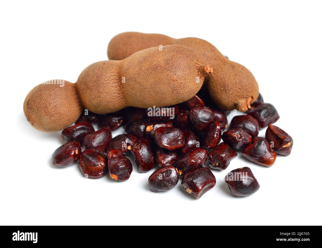 Ripe tamarind fruit and seeds isolated on white background Stock Photo ...