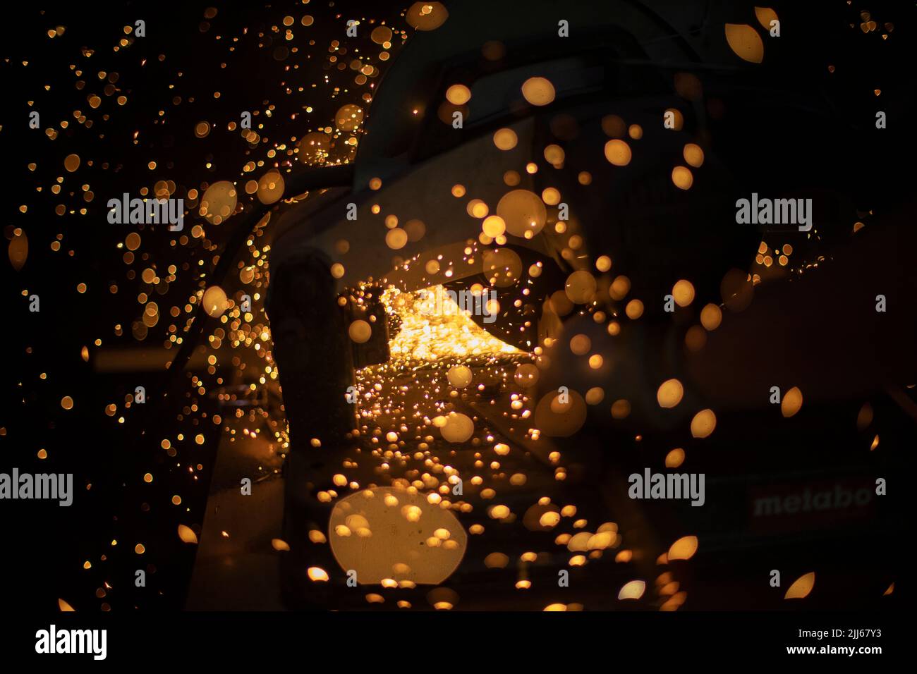 Sparks of metal. Steel sawing. Industrial background. Lots of bright ...