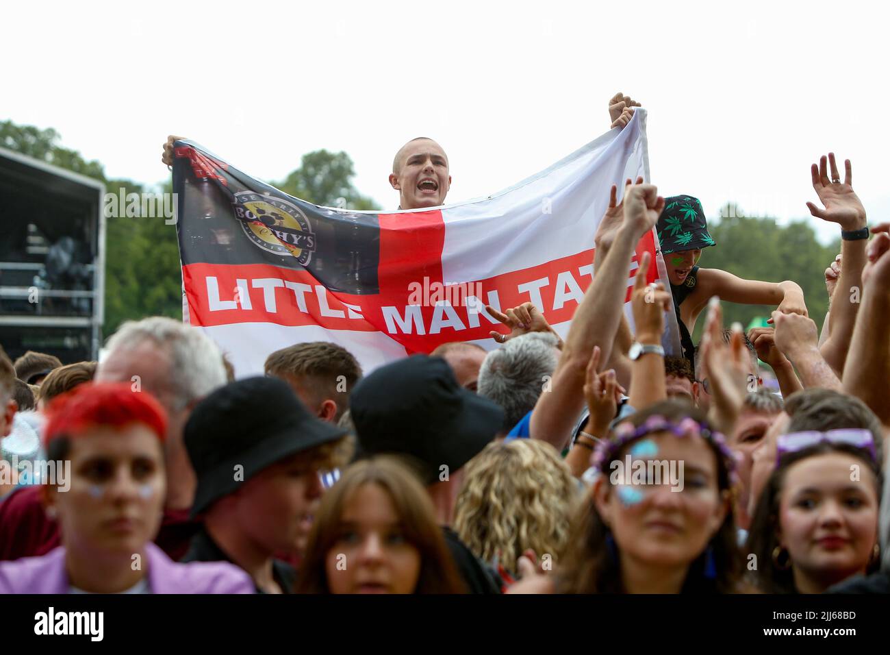 A fan holds up a Little Man Tate banner Stock Photo - Alamy