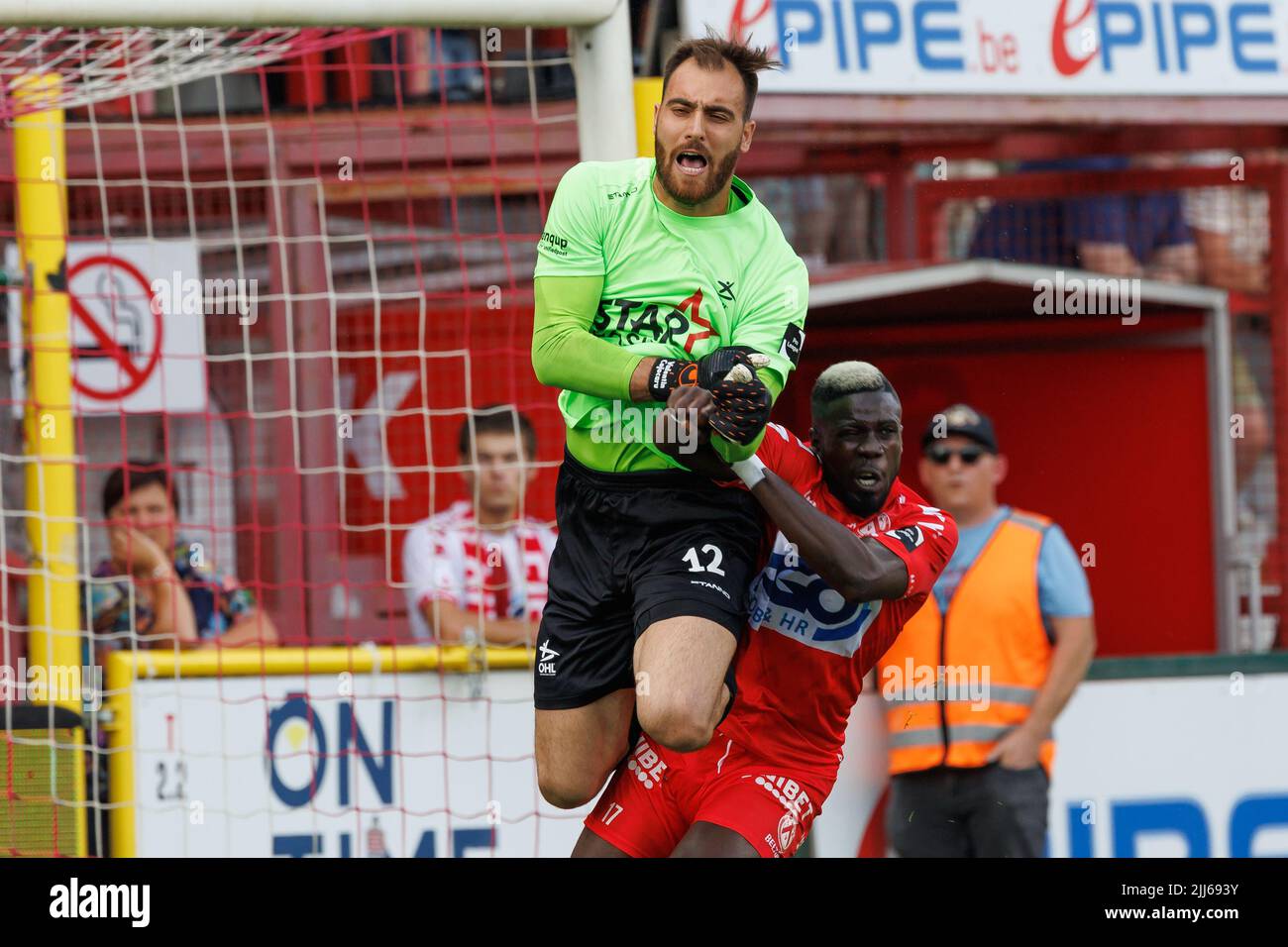 OHL's Valentin Cojocaru and Kortrijk's Pape Habib Gueye fight for the ball during a soccer match ...