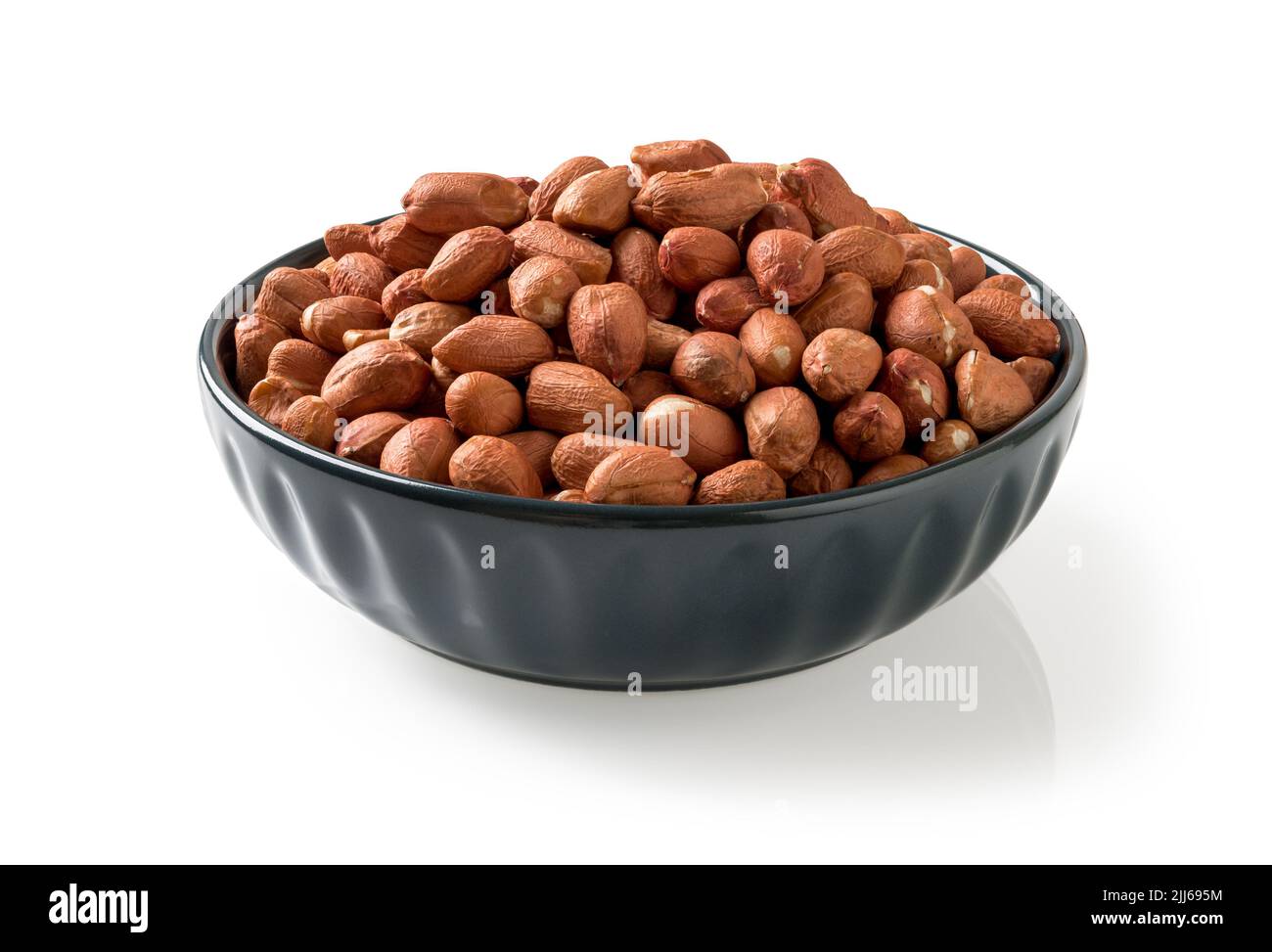 Closeup of raw peanut in a blue bowl isolated on a white background ...