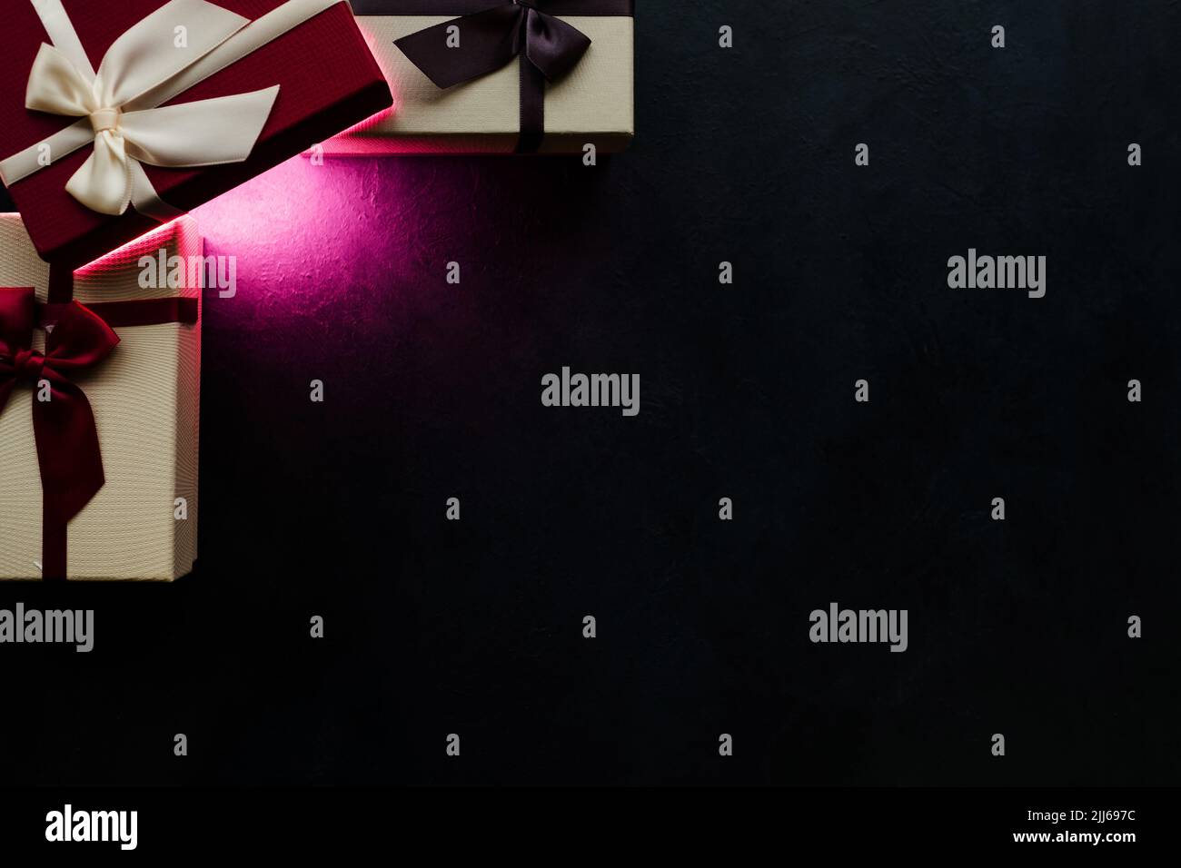 mysterious light gift box surprise present dark Stock Photo - Alamy