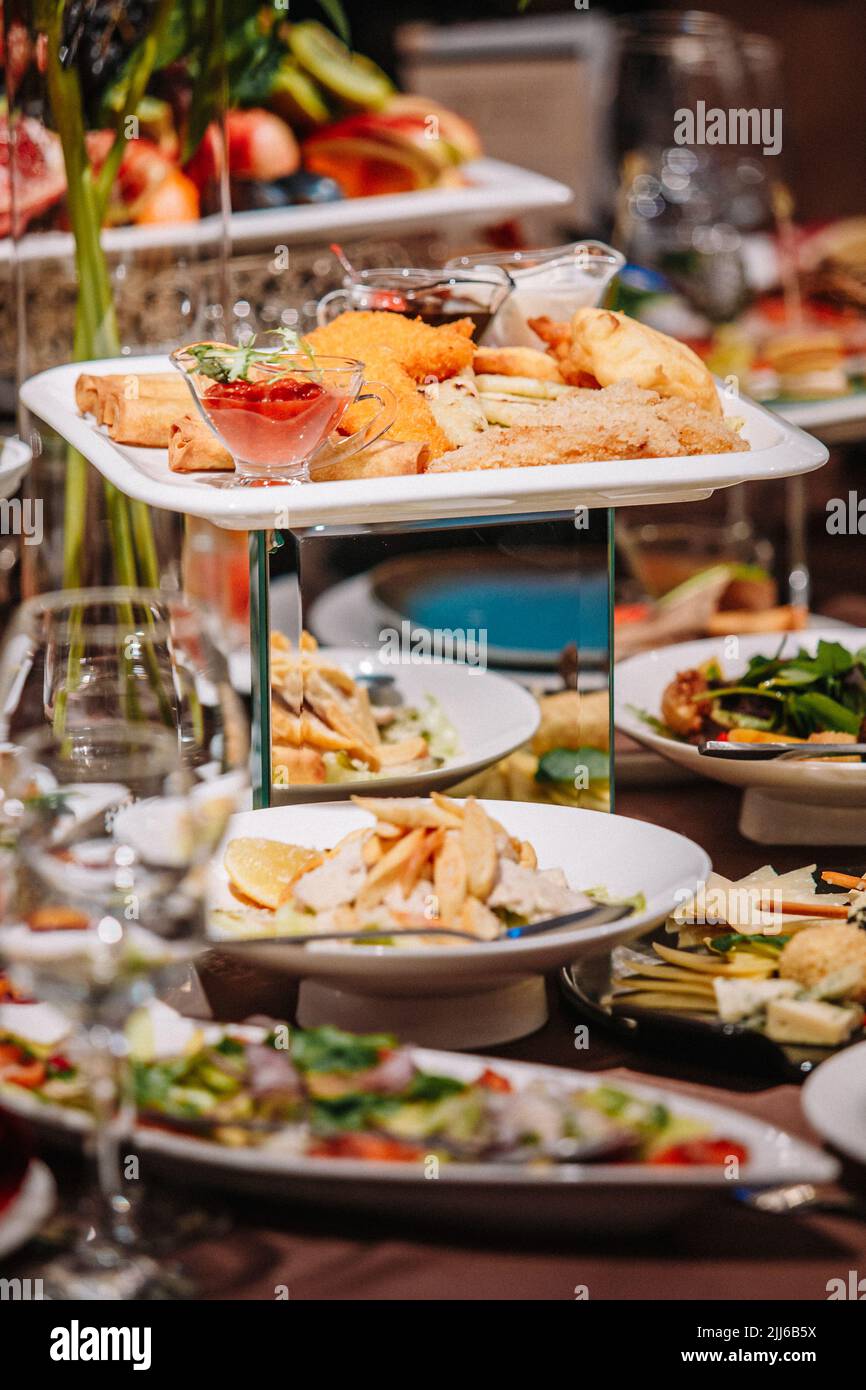 many dishes and snacks on the festive table Stock Photo - Alamy