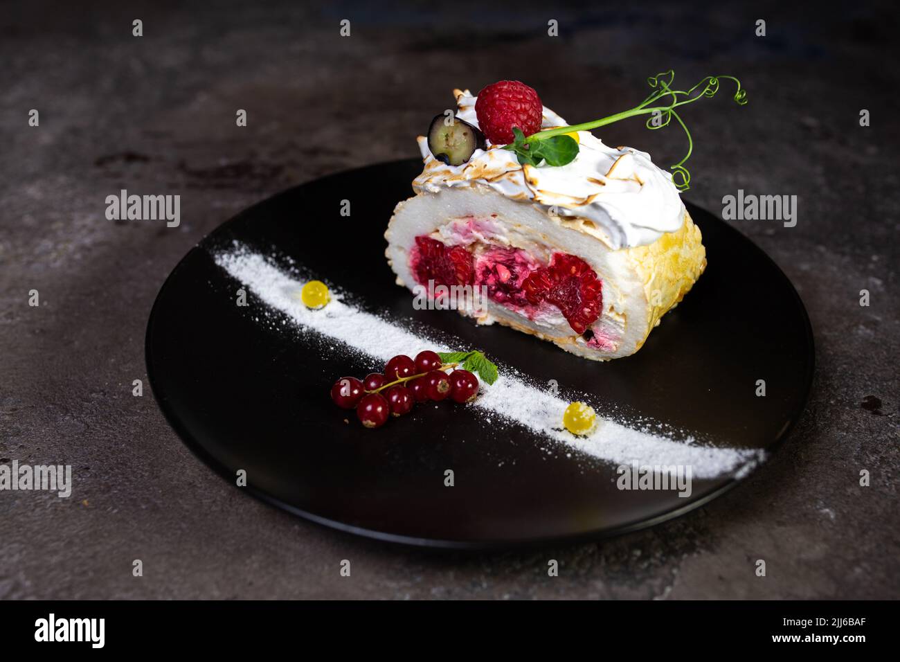 Meringue roll with delicate air cream and raspberry fruit filling Stock ...