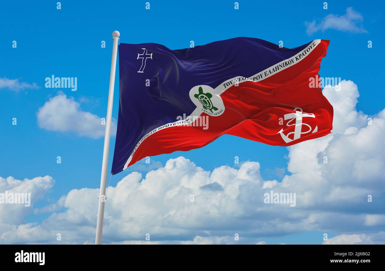 official flag of Aegina Greece at cloudy sky background on sunset ...