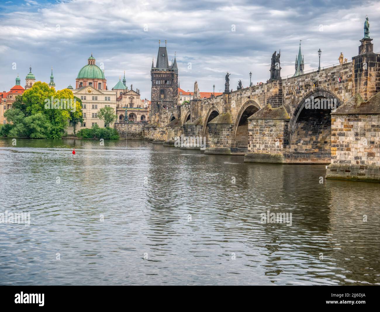 Prague, Czech Republic - June 2022: View with the Charles Bridge main touristic attraction ...