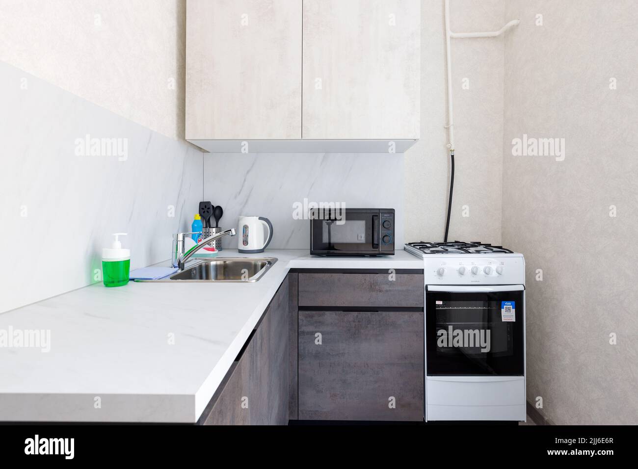 Photo of the kitchen in the apartment for daily rent Stock Photo - Alamy