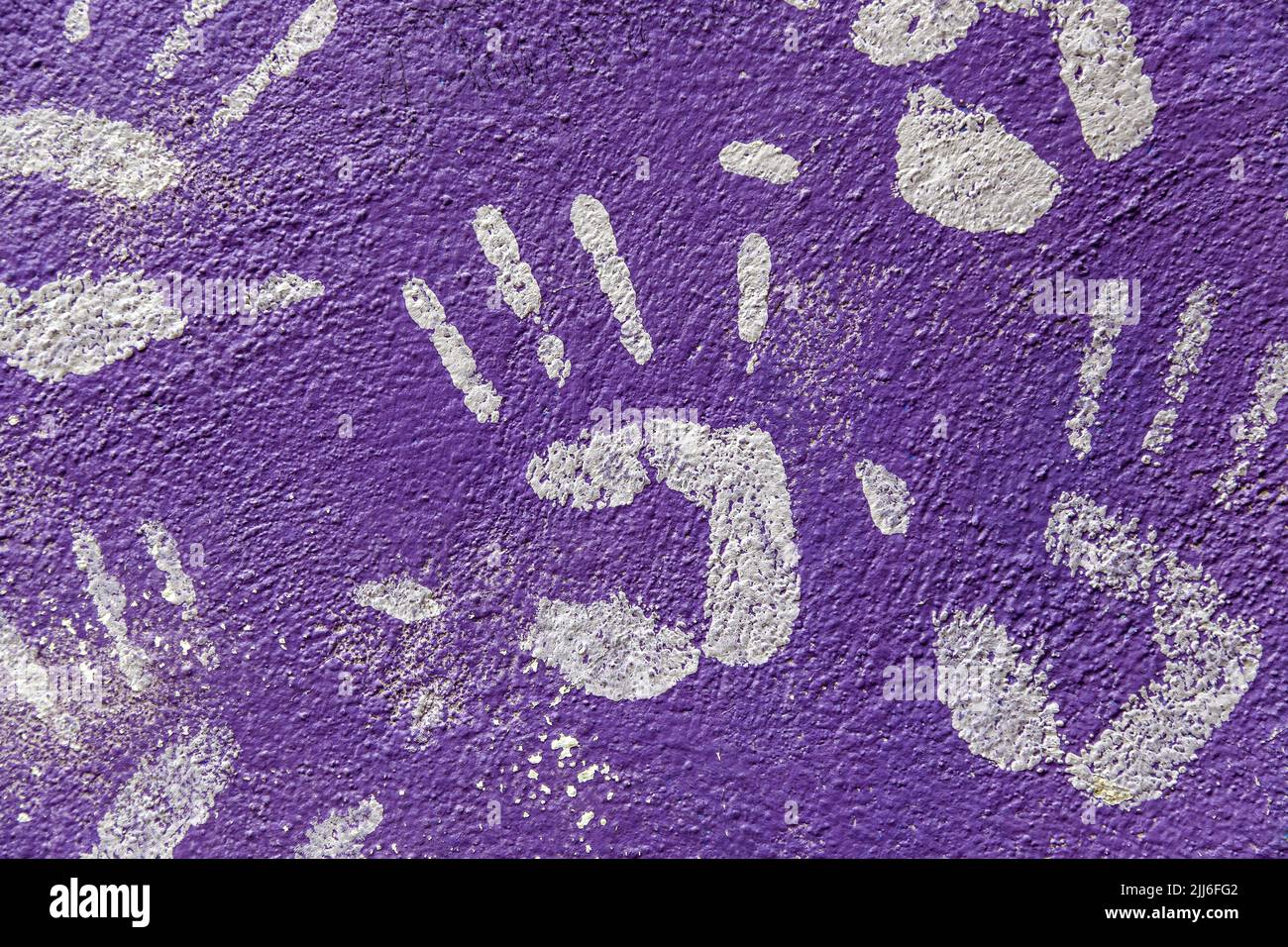 Detail of decoration with painting on a wall, painted hands, freedom ...