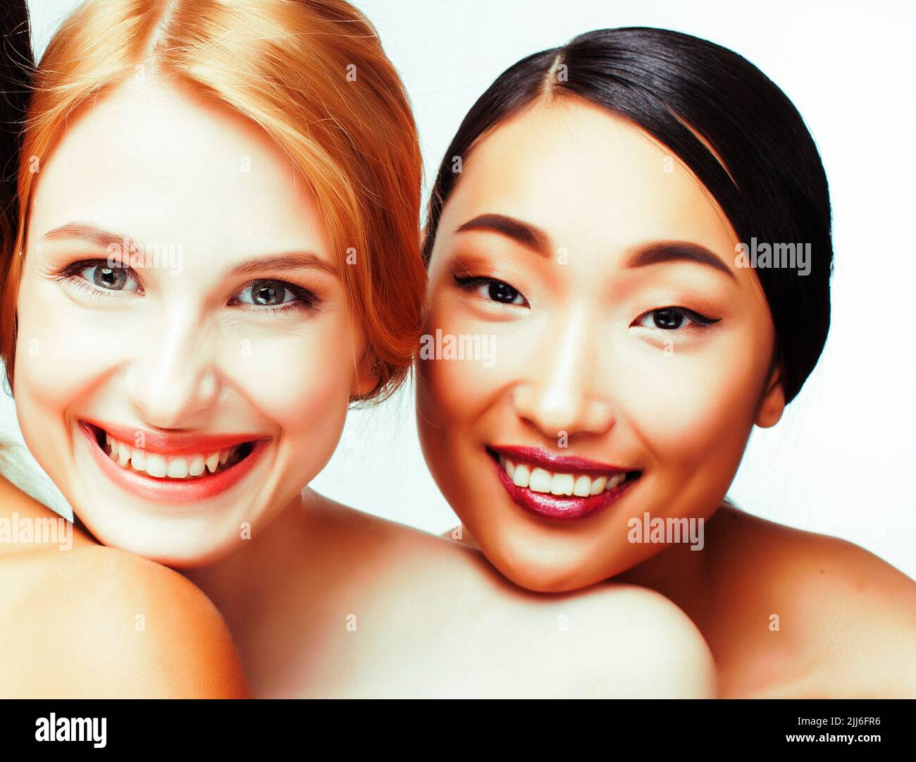 different nation woman: caucasian and asian together isolated on white ...