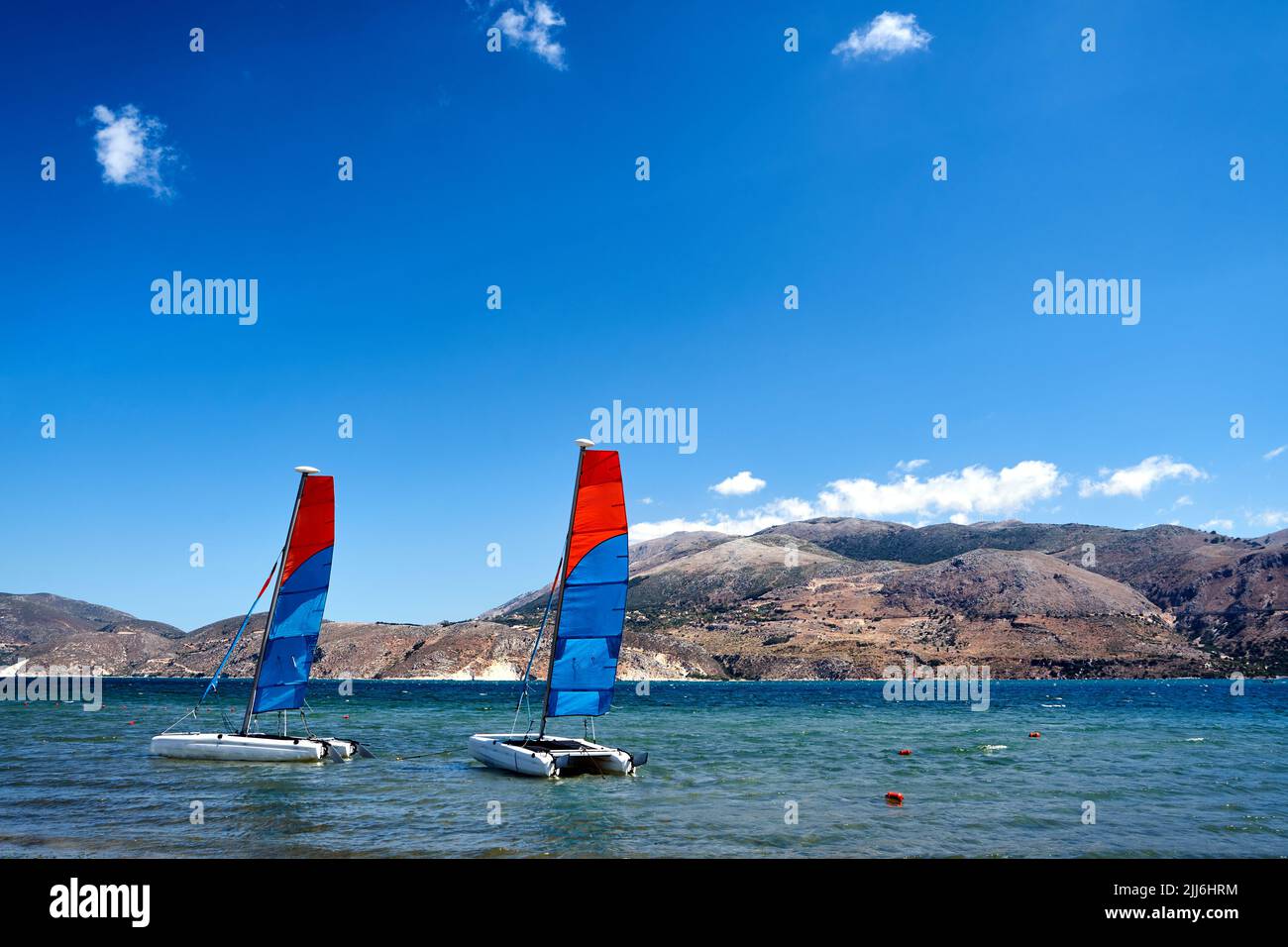 Mountain sea bay catamarans hi-res stock photography and images - Alamy