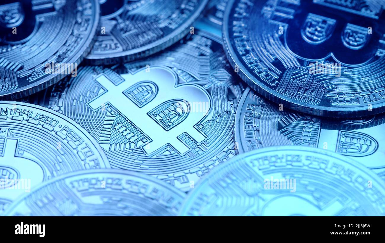 Bitcoin, crypto currency. Blue coins rotating clockwise. Digital ...