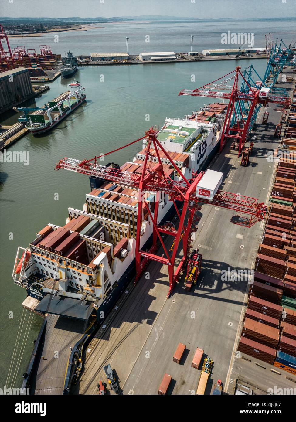 A vertical shot of a port with cargo ships Stock Photo - Alamy