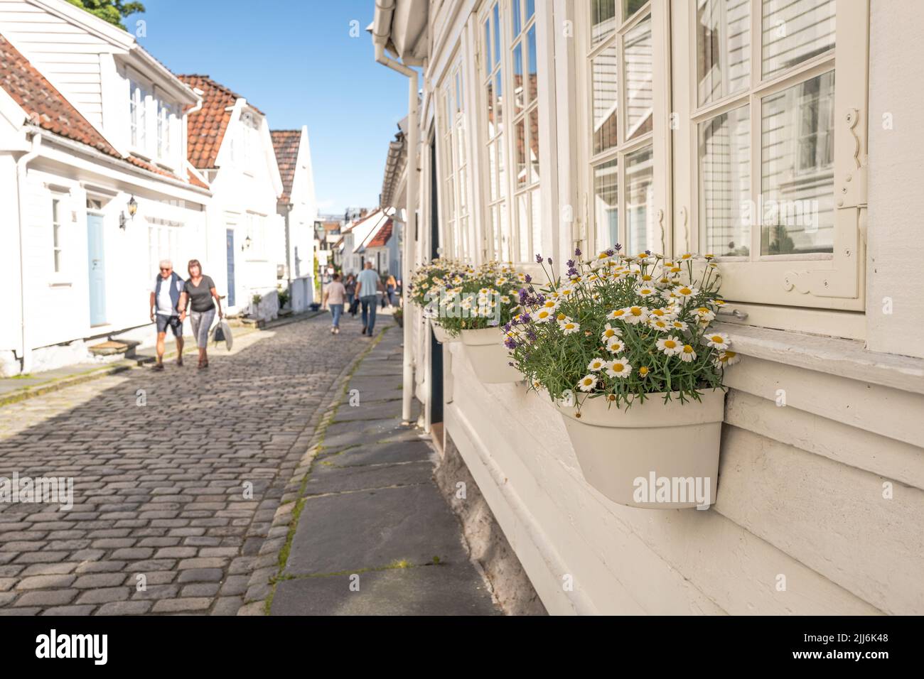 Traditional Norwegian white painted timber built housing in the old ...
