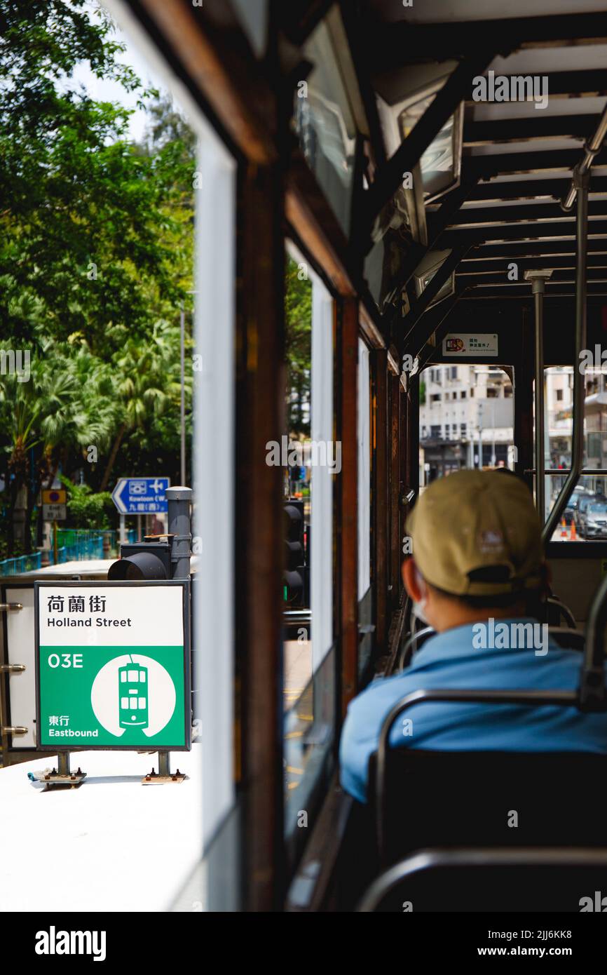 A vertical shot of a male on the second floor of a bus on Holland ...