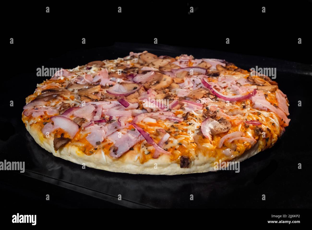 Baked homemade pizza in electric oven at home Stock Photo - Alamy