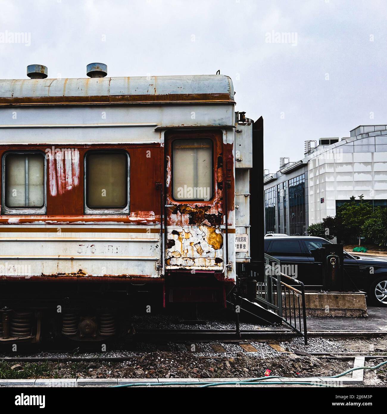 An old rusty wagon in the station Stock Photo - Alamy
