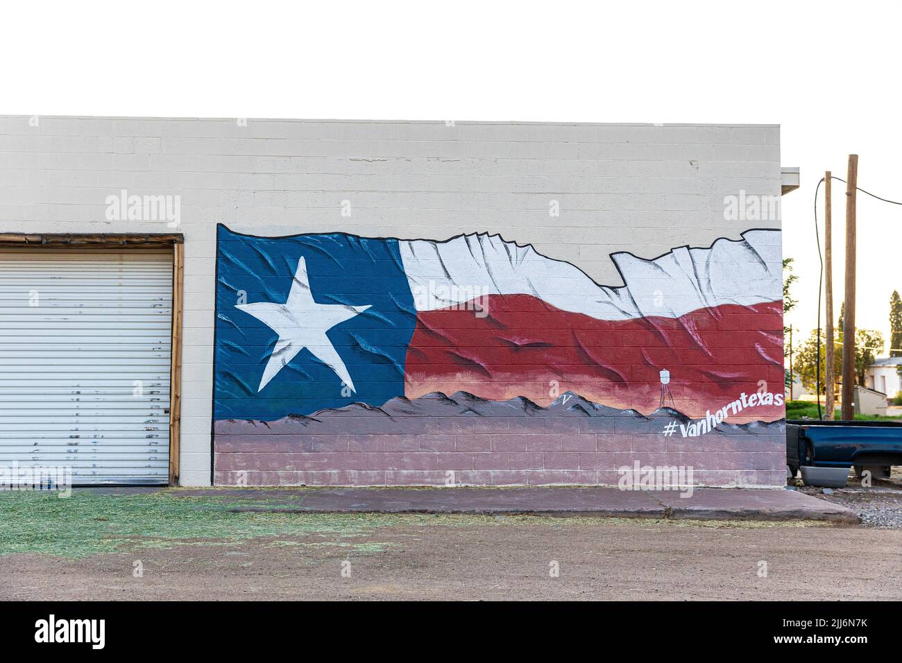 A closeup of a mural of the Texas Flag on the building wall ...