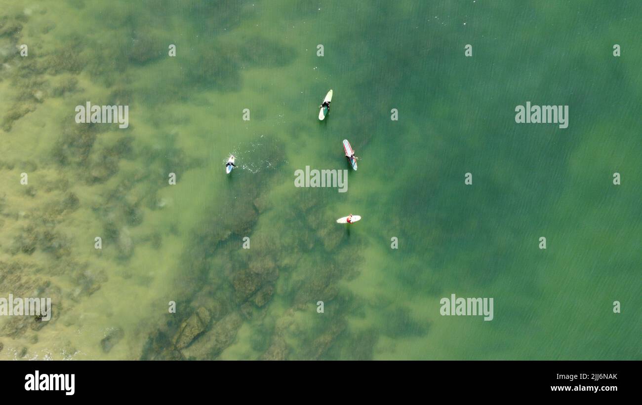An aerial view of rowing boats floating in the clear ocean water Stock ...