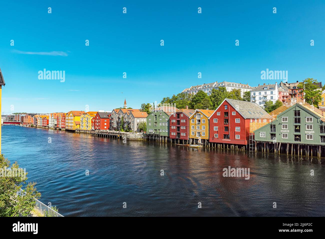 A beautiful view of houses along the Nidelva River in Trondheim, Norway ...