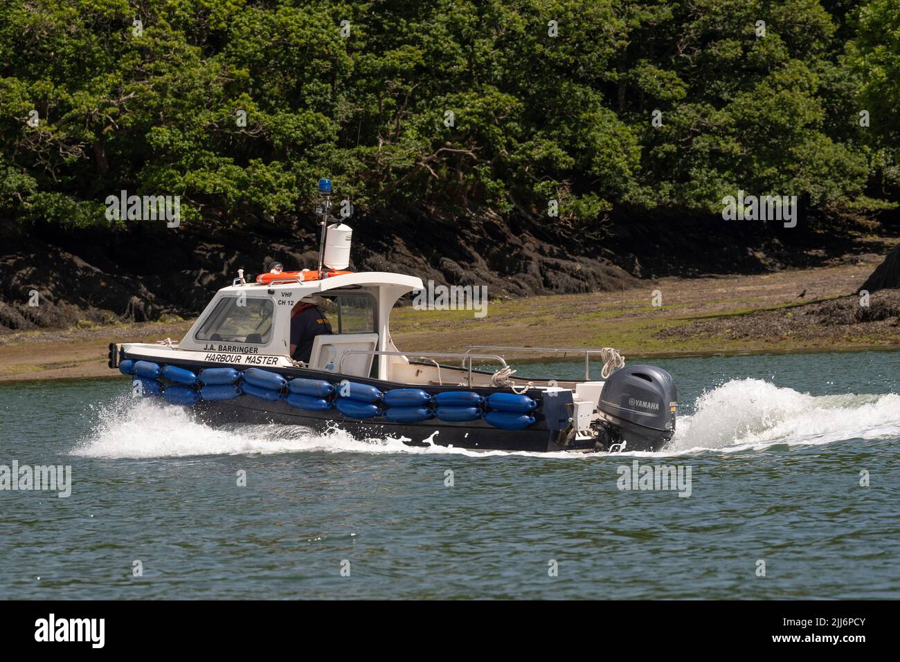River Fal, Cornwall, England, UK. 2022. Harbour masters launch at speed ...