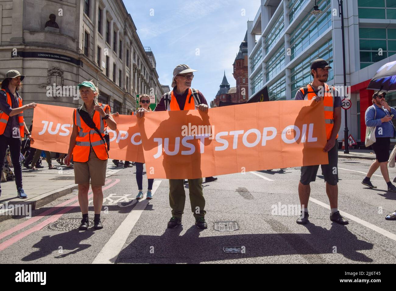 Protesters hold a Just Stop Oil banner during the demonstration in ...