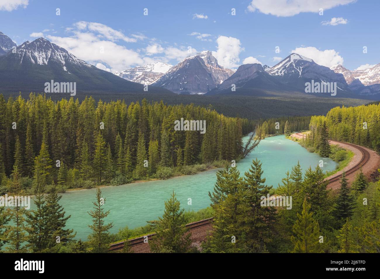 Scenic landscape view of railway train tracks and the Bow River at ...