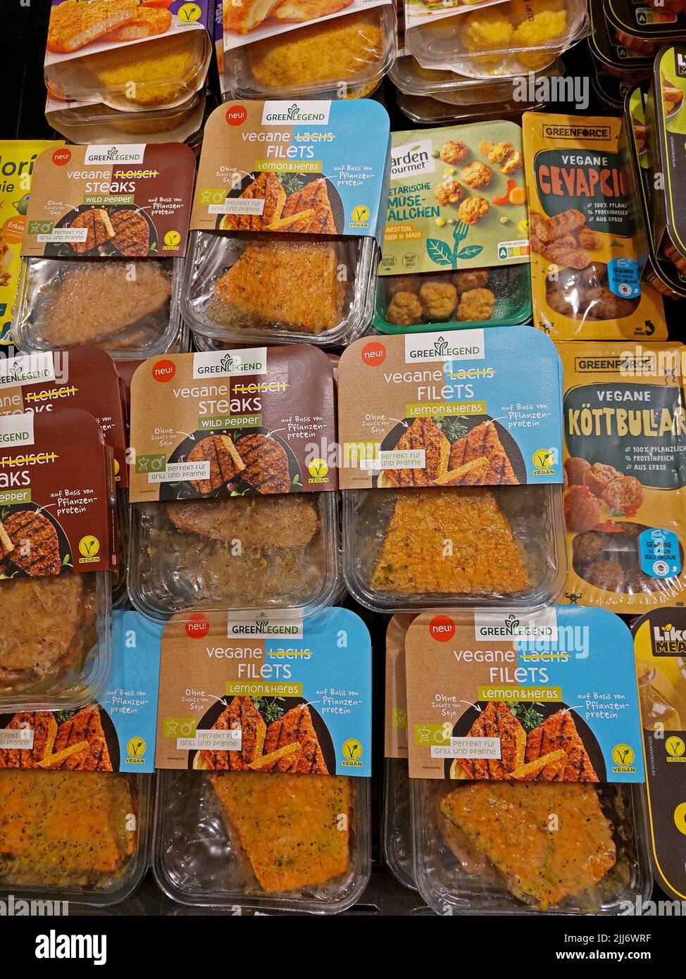 selection of vegan food packages made by different brands in a ...