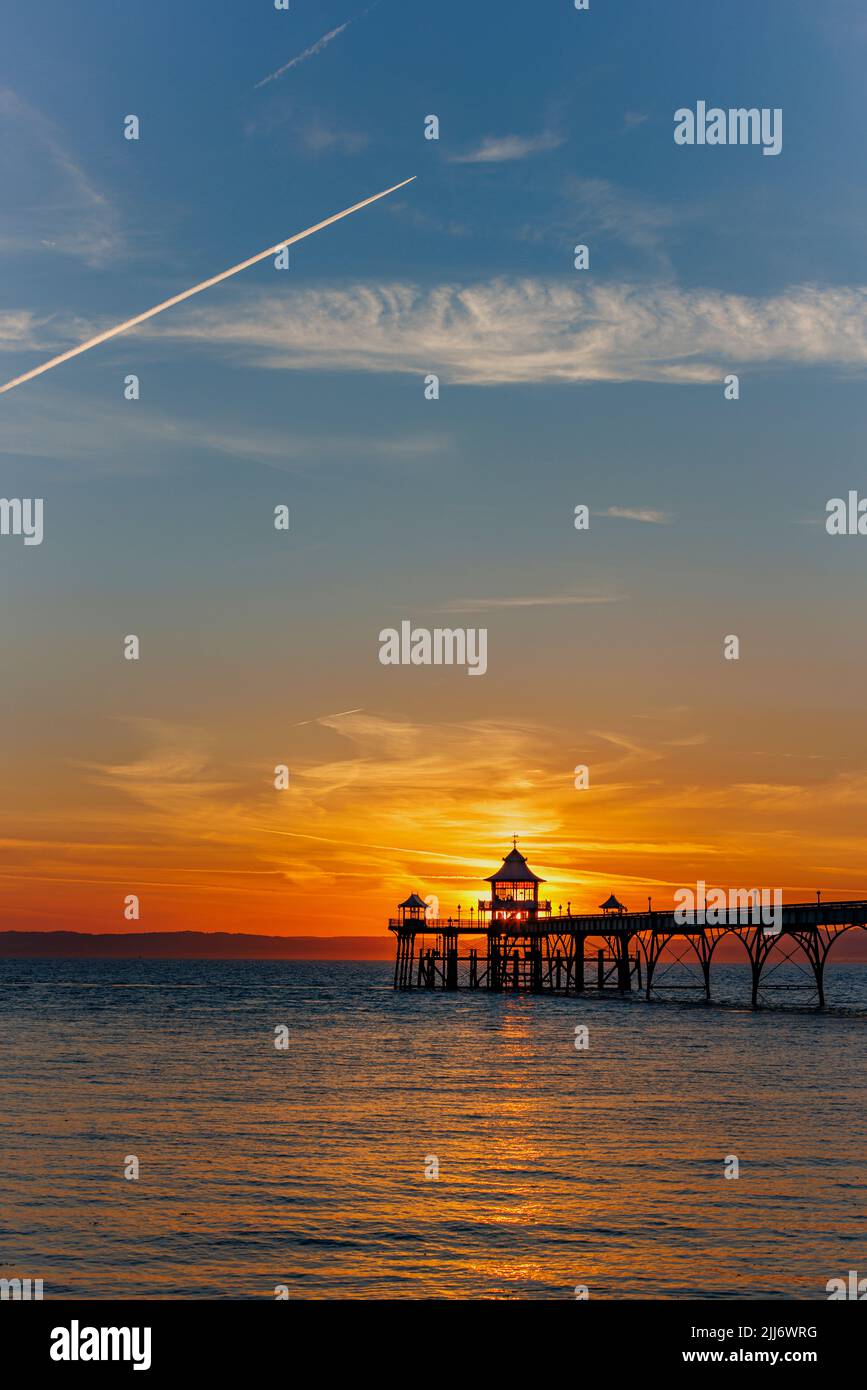 The setting sun lighting up the horizon Stock Photo - Alamy